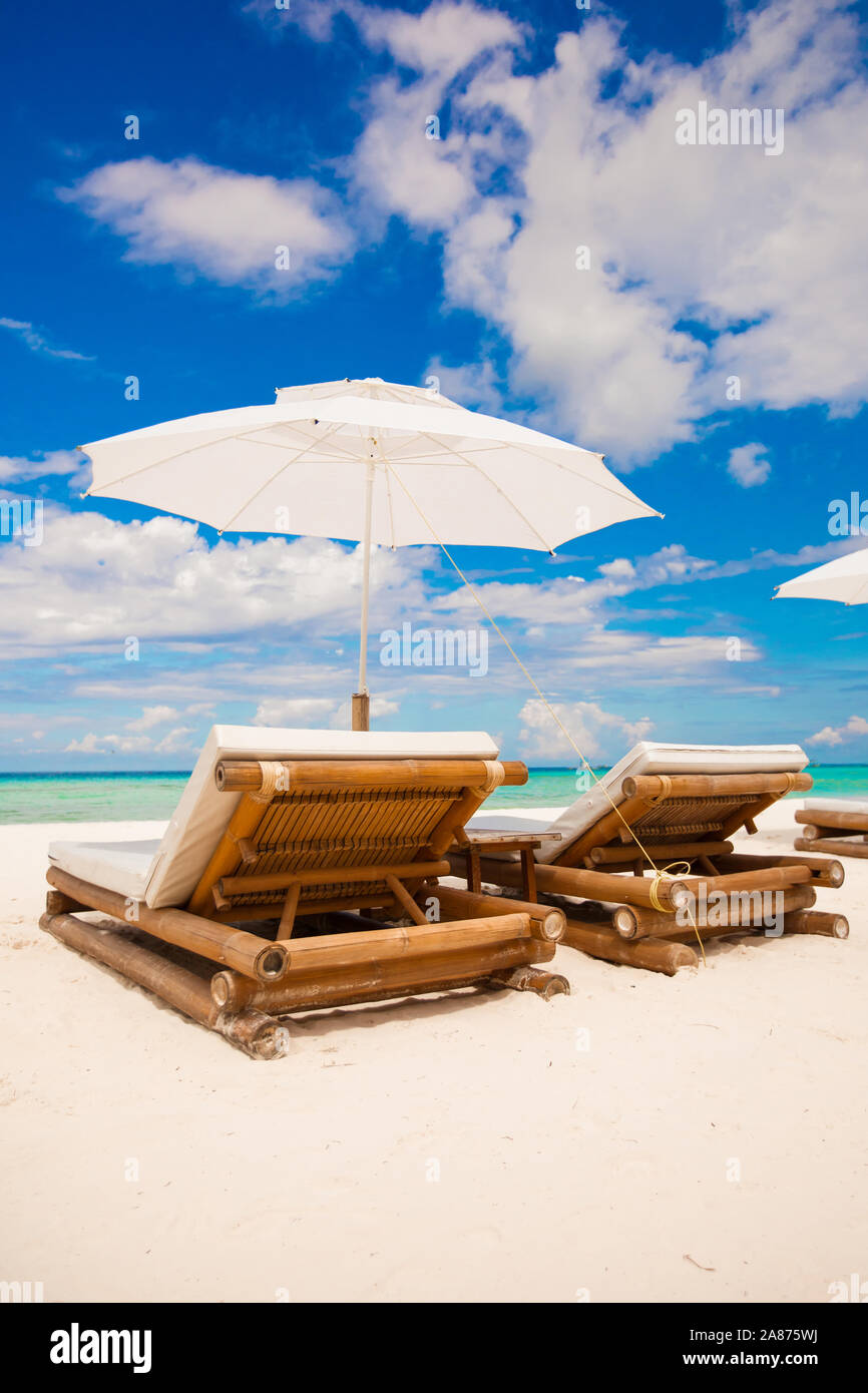 Beach wooden chairs for vacation on tropical beach Stock Photo - Alamy