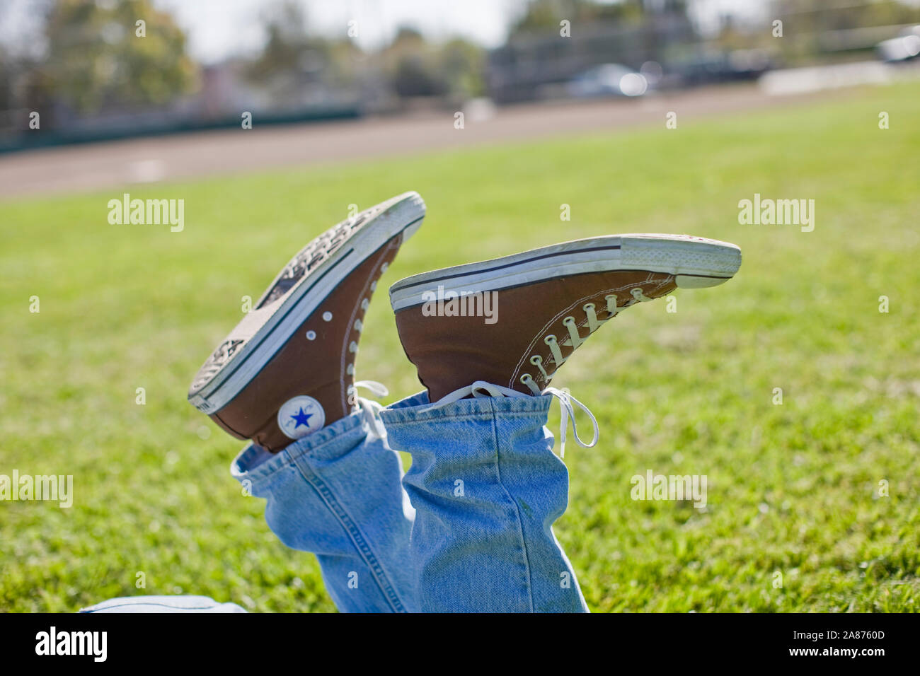 Teenage boys brown sneakers Stock Photo - Alamy