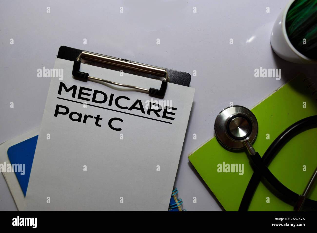 Medicare Part C write on document isolated white background. medical or ...