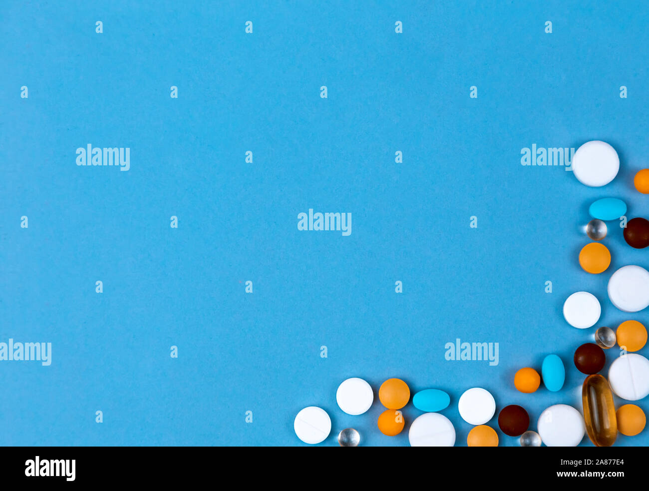 Pills Set As Border. Colored pills set as border on blue background ...