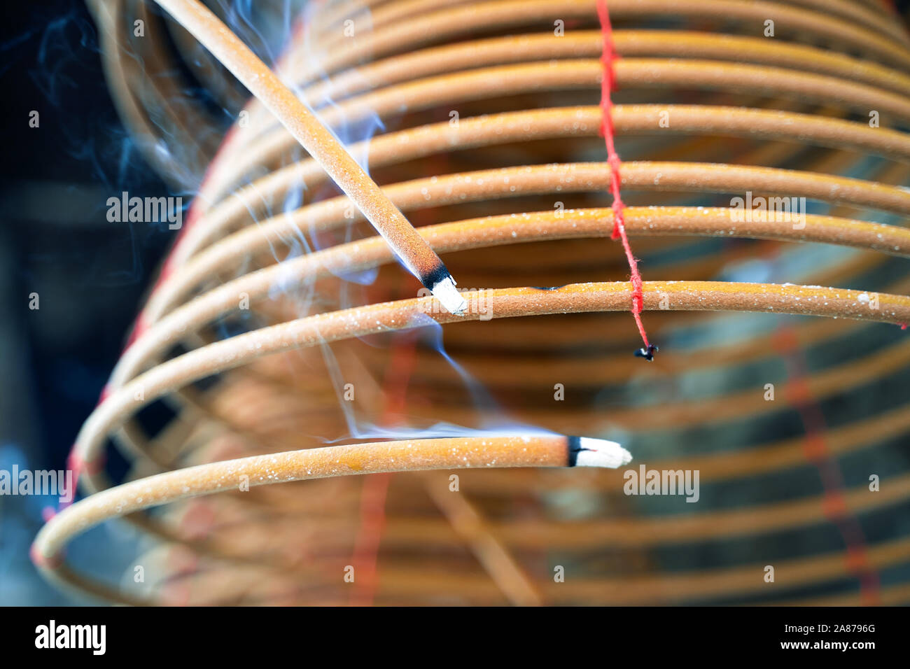 Burned coil swirl incense in Macau (Macao) temple, traditional Chinese ...