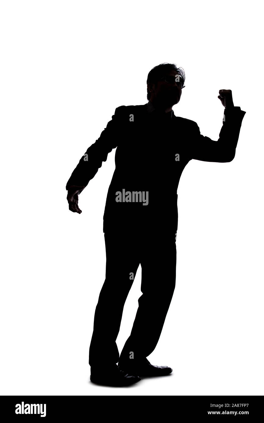 Silhouette of a backlit model posing as a businessman on a white ...