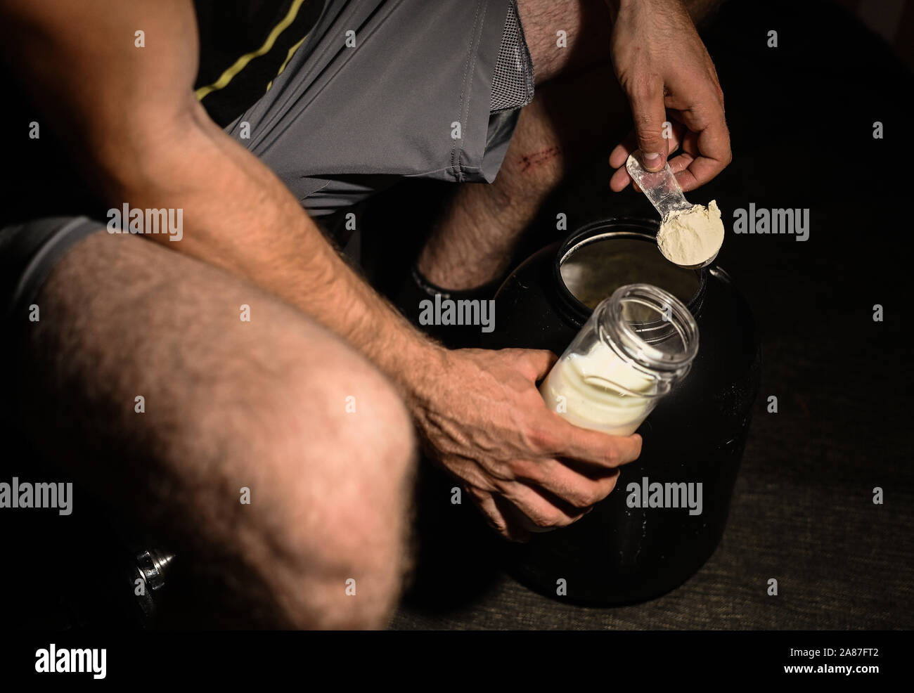 Ebing, Germany. 03rd Nov, 2019. ILLUSTRATION - A man mixes protein ...