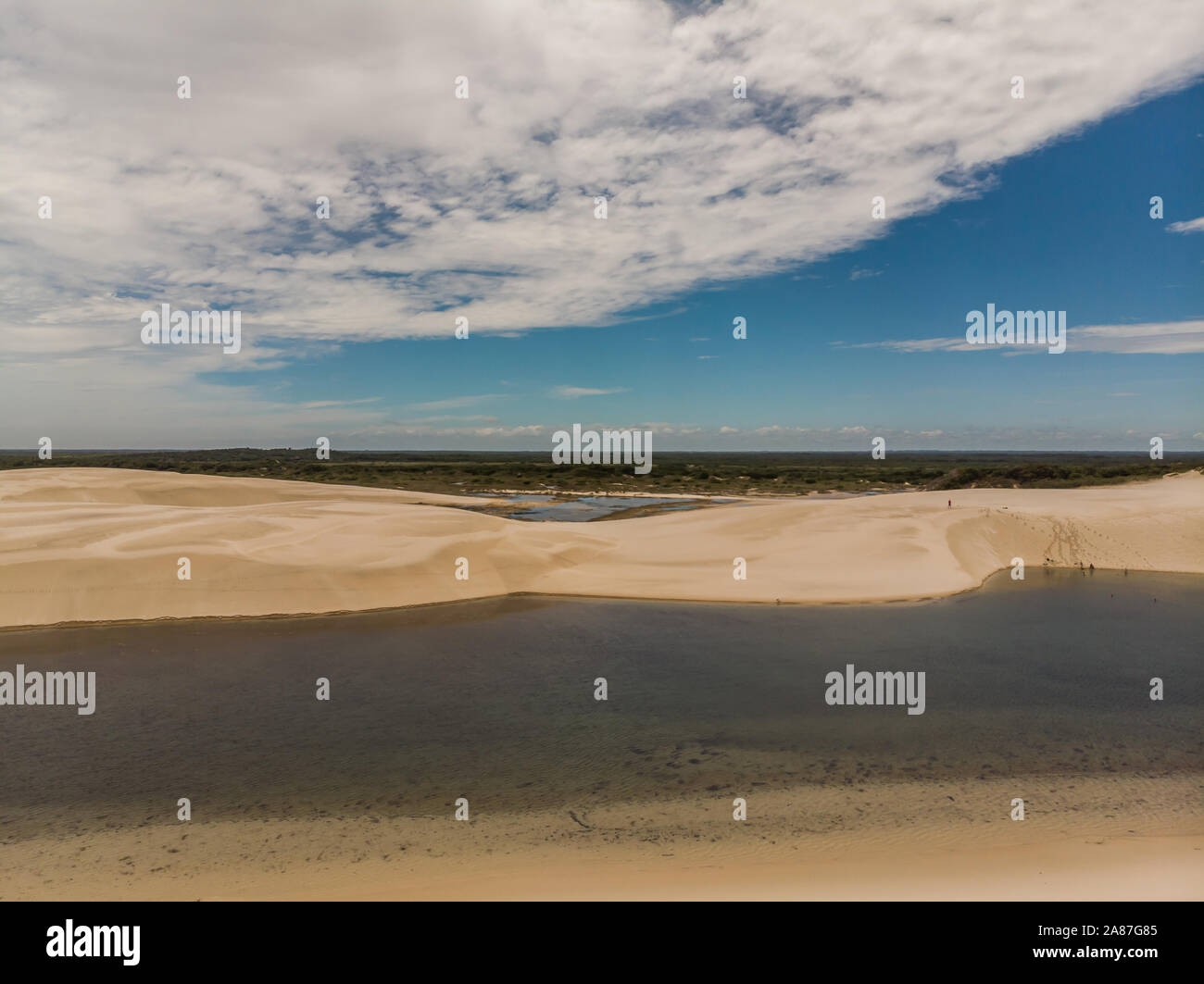 Aerial shot of the sand dunes and lagoons in Brazil, Lencois ...