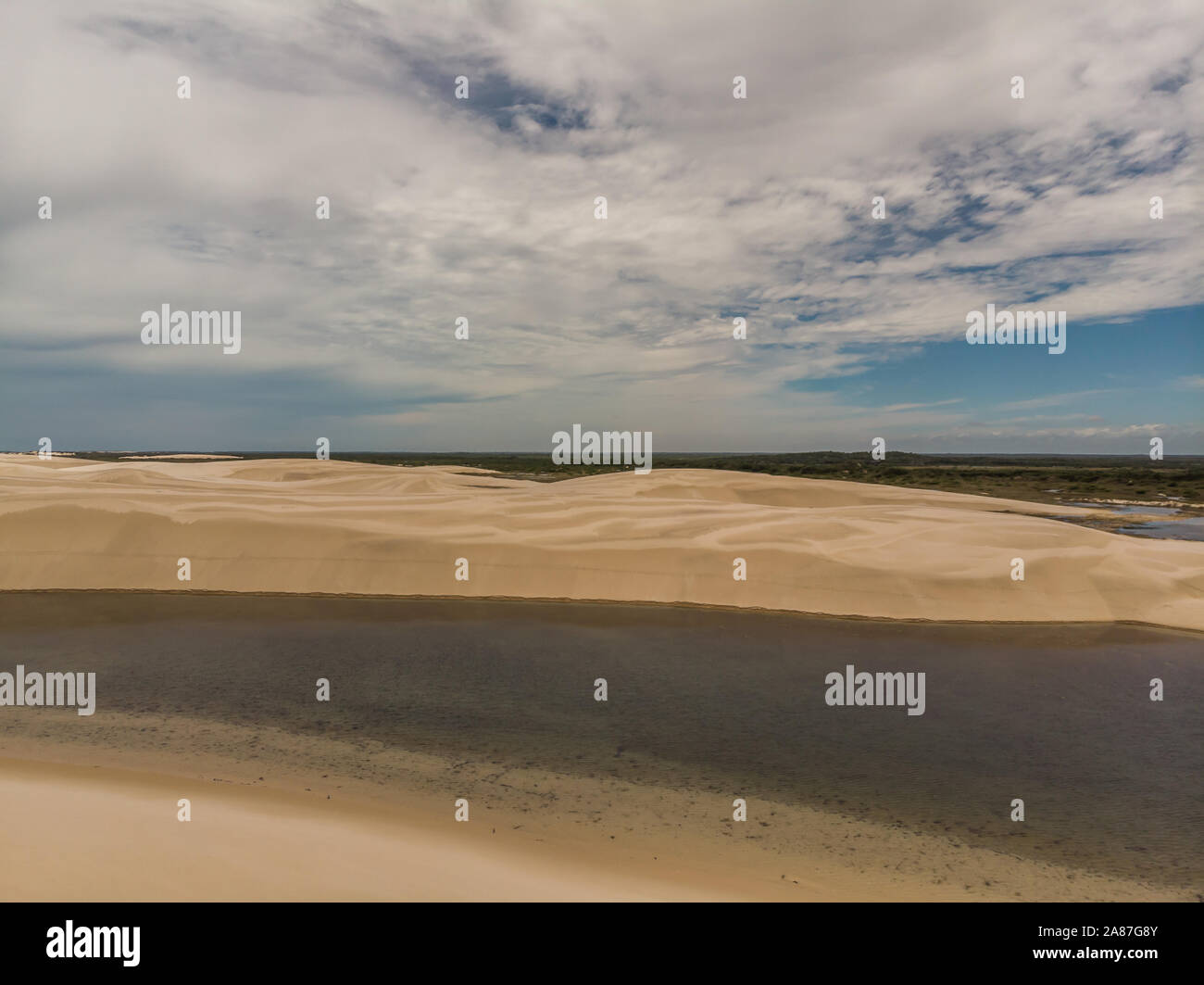 Aerial shot of the sand dunes and lagoons in Brazil, Lencois ...