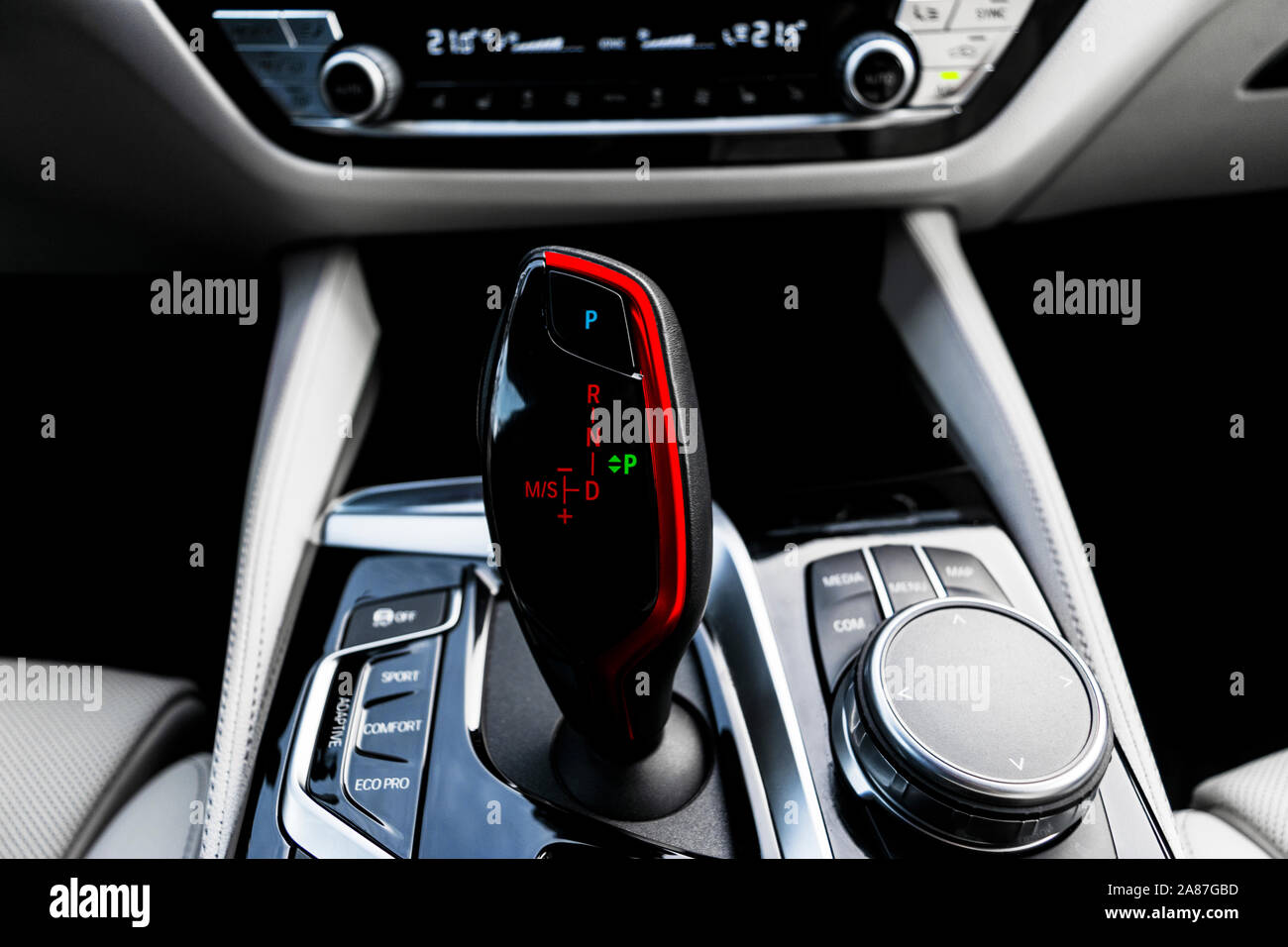 Red automatic gear stick of a modern car. Modern car interior details. Close up view. Car ...