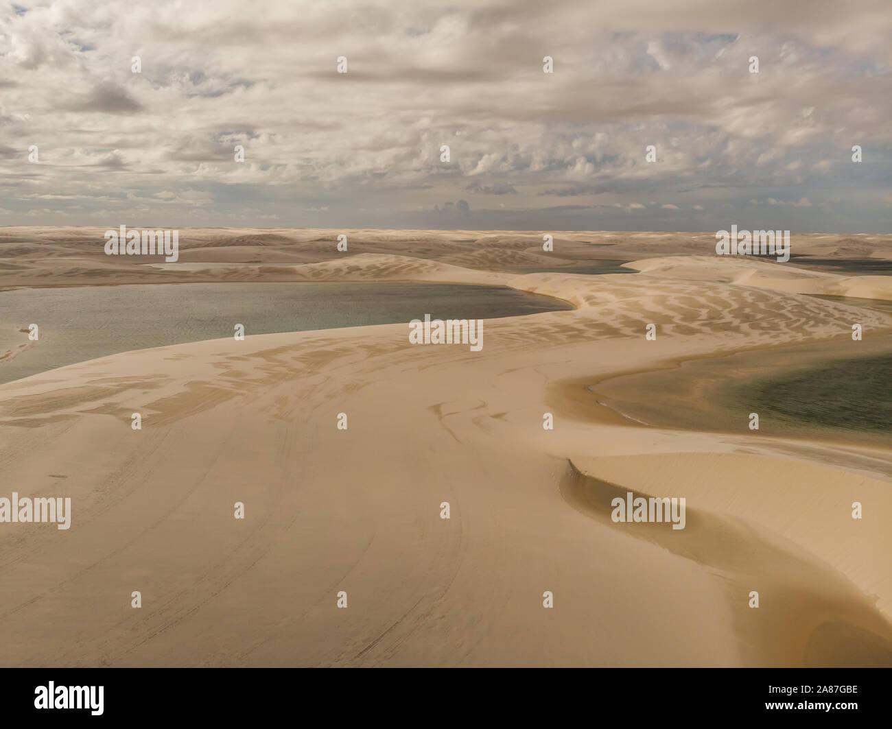 Aerial shot of the sand dunes and lagoons in Brazil, Lencois ...