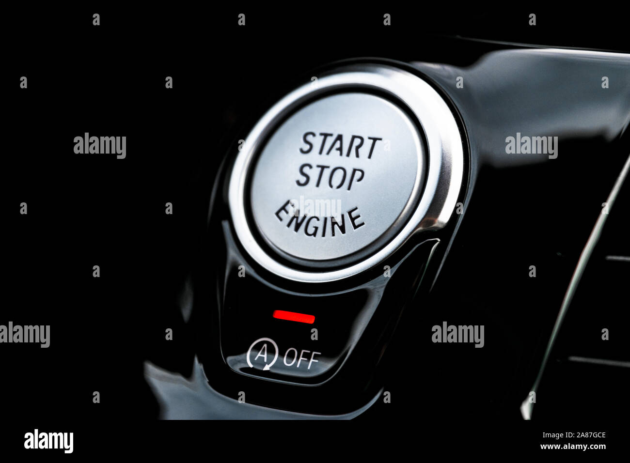 Car dashboard with focus on engine start stop button. Modern car ...