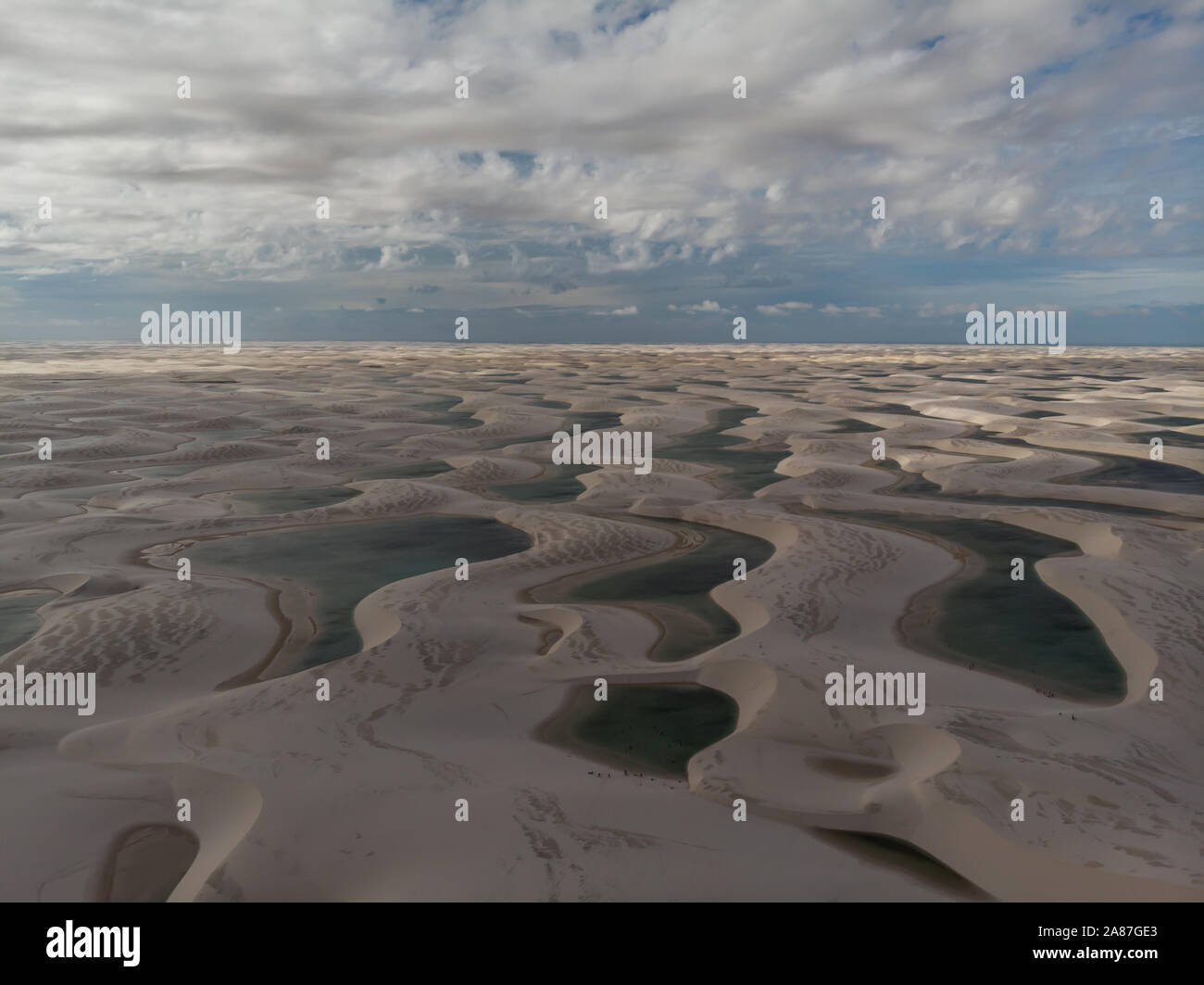 Aerial shot of the sand dunes and lagoons in Brazil, Lencois ...
