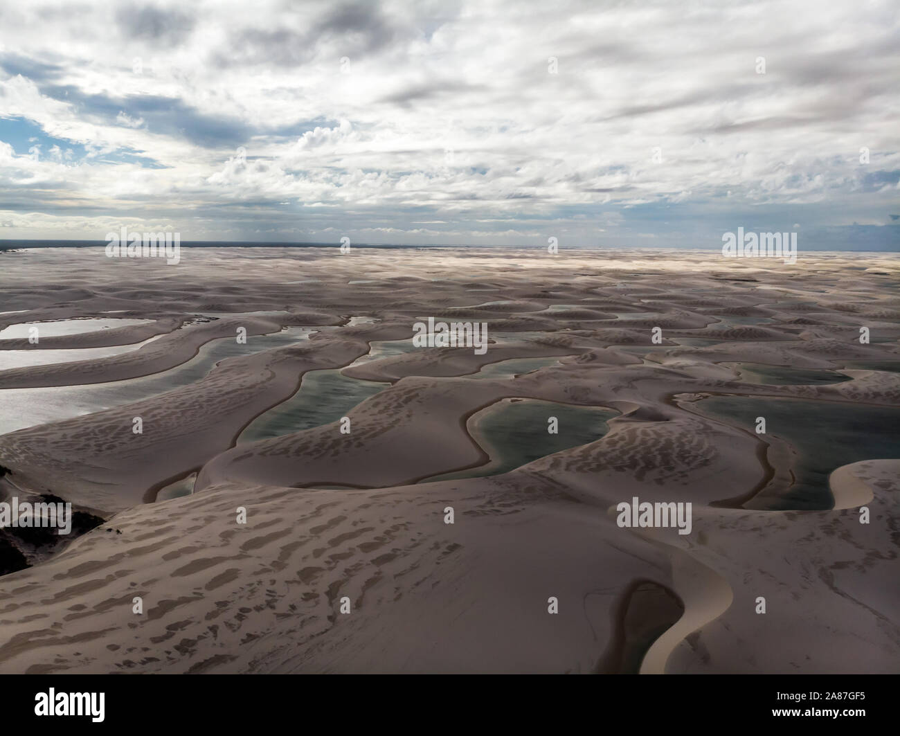 Aerial shot of the sand dunes and lagoons in Brazil, Lencois ...