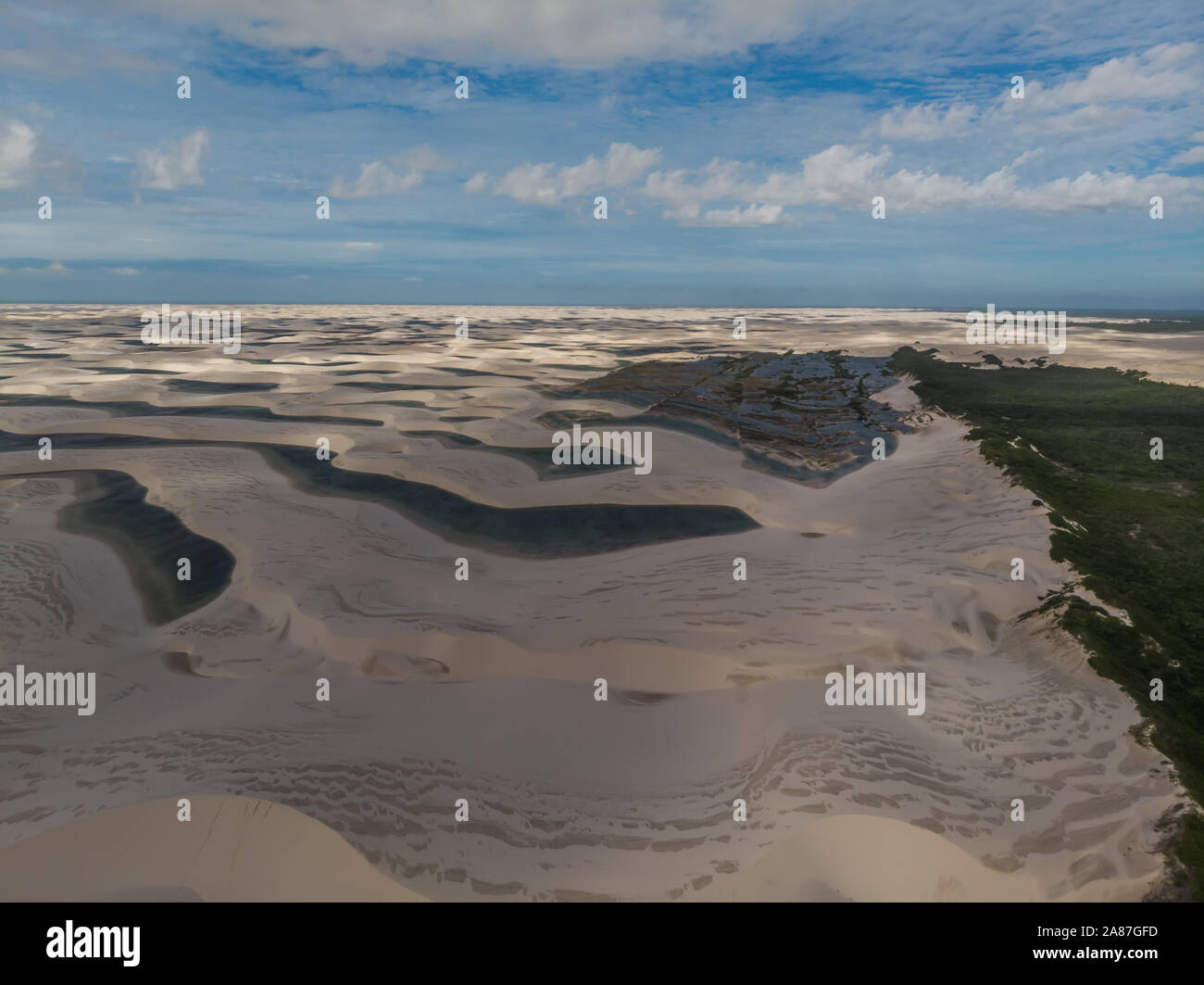 Aerial shot of the sand dunes and lagoons in Brazil, Lencois ...