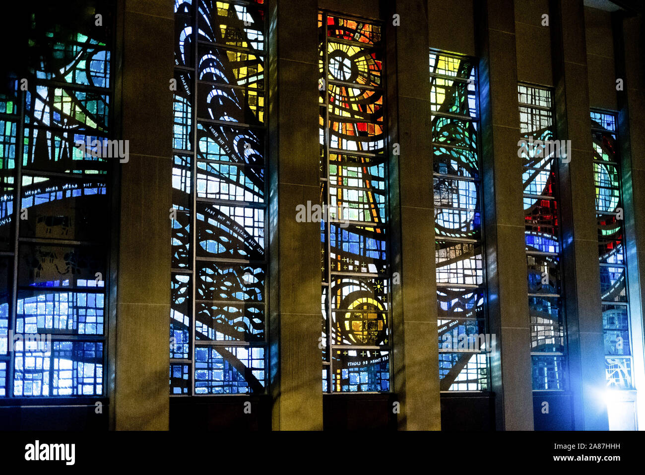 Stained glass from the Tree of Life synagogue seen at night.One year ...
