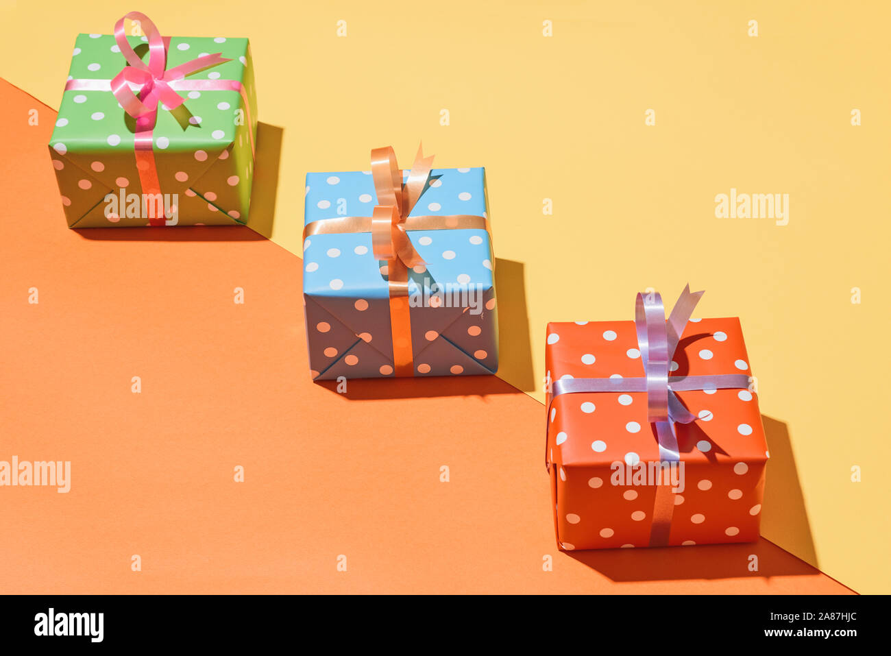 Christmas gifts paper decorated with ribbon on light color paper ...