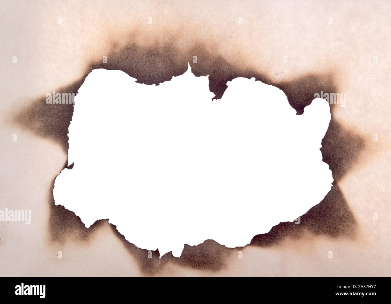 Burnt hole in a paper Stock Photo - Alamy