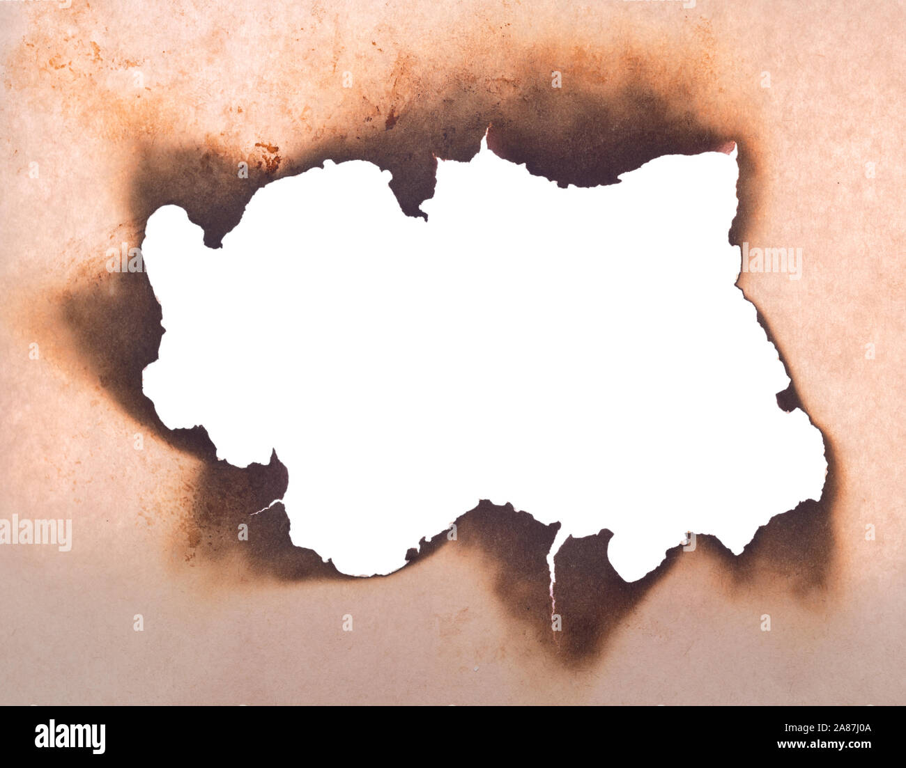 Burnt hole in a paper Stock Photo - Alamy