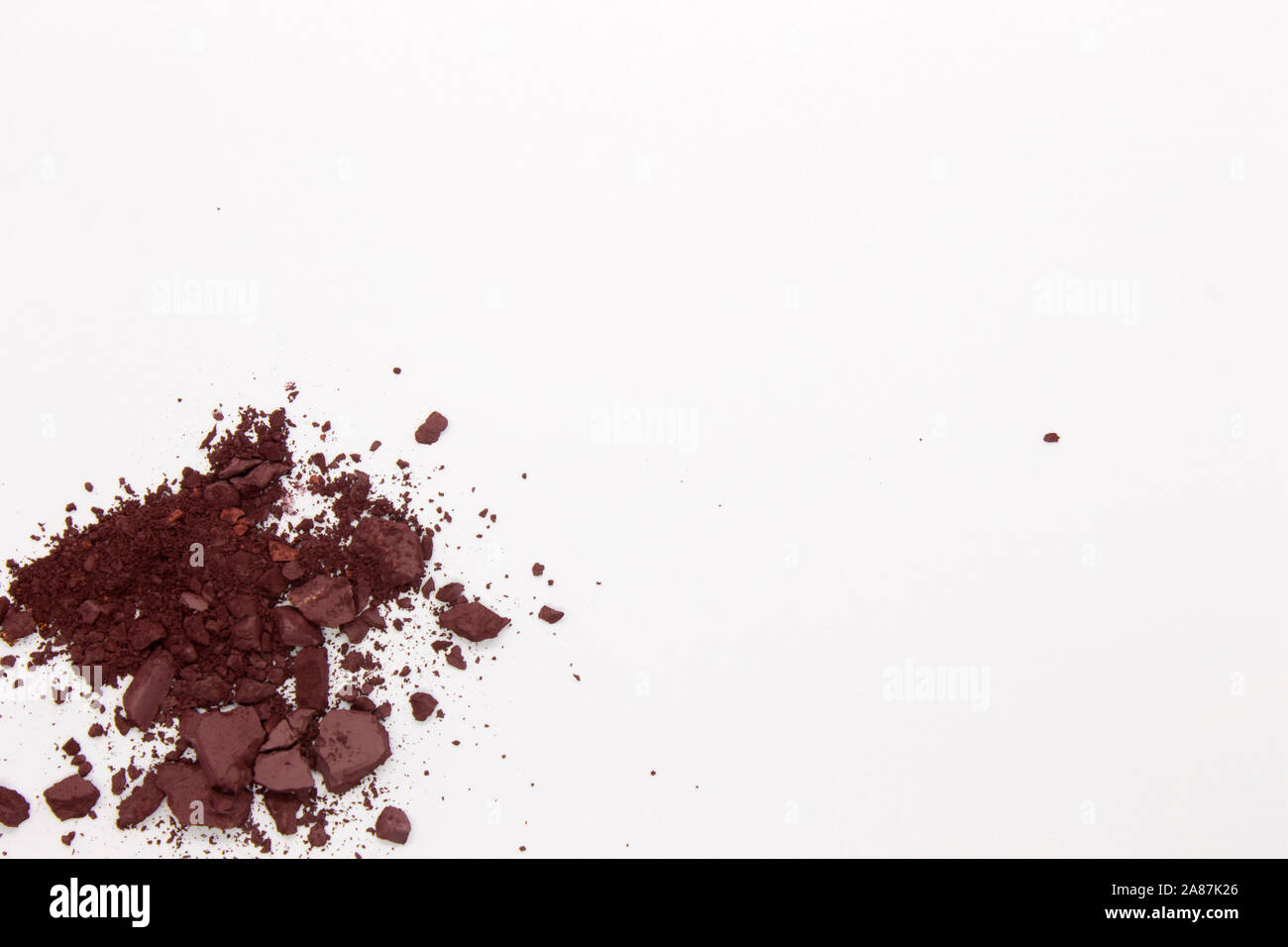 This is a photograph of a Matte Dark Purple Powder Eye shadow isolated ...
