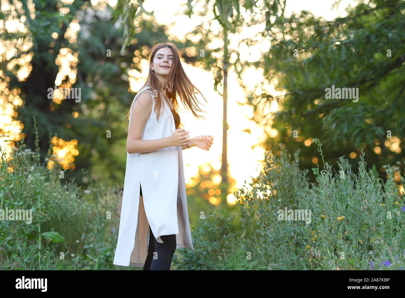 young girl on nature shows emotions Stock Photo - Alamy