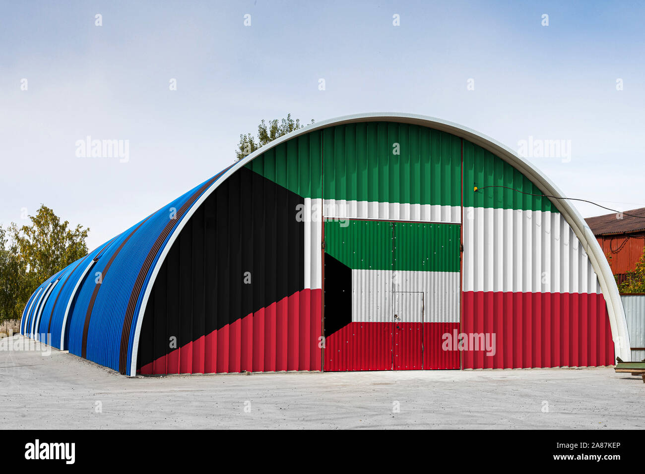 Close-up of the national flag of Kuwait painted on the metal wall of a ...