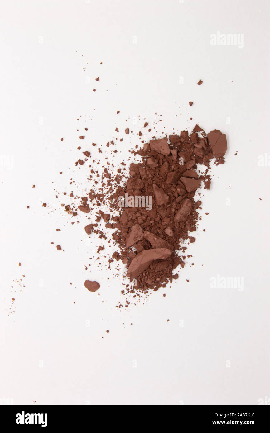 This is a photograph of a deep Brown Powder Eye shadow isolated on a ...