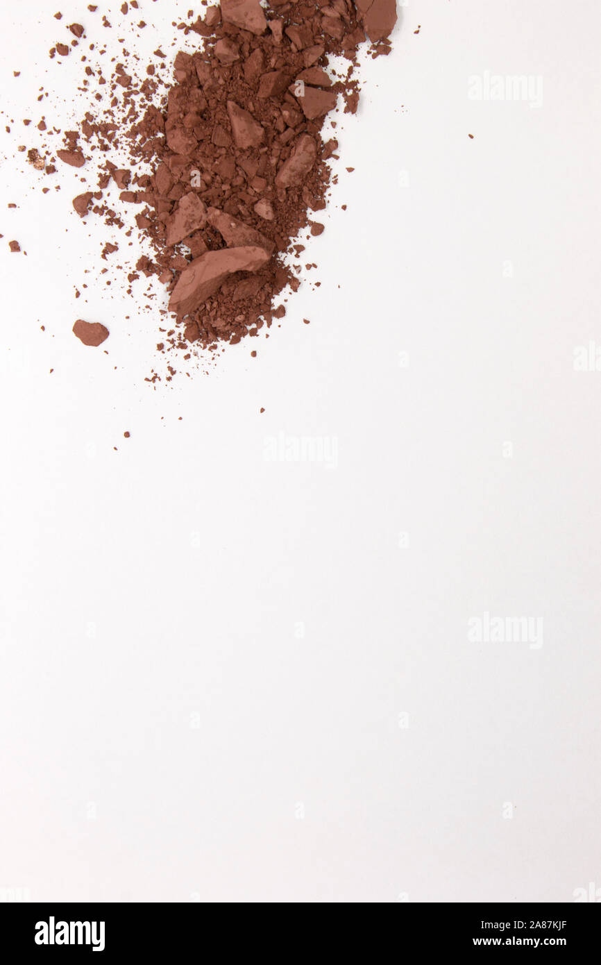 This is a photograph of a deep Brown Powder Eye shadow isolated on a ...