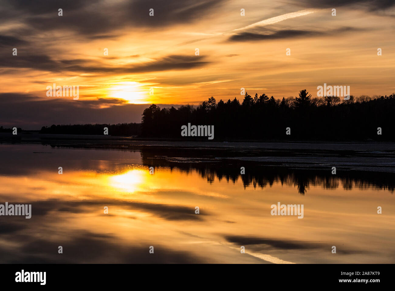 Sunset reflected off the water near Ash River Visitor Center in ...