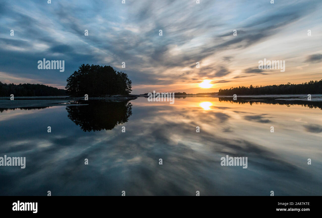 Sunset reflected off the water near Ash River Visitor Center in ...