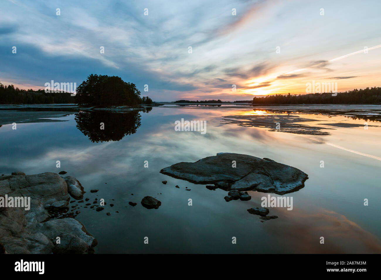 Sunset reflected off the water near Ash River Visitor Center in ...