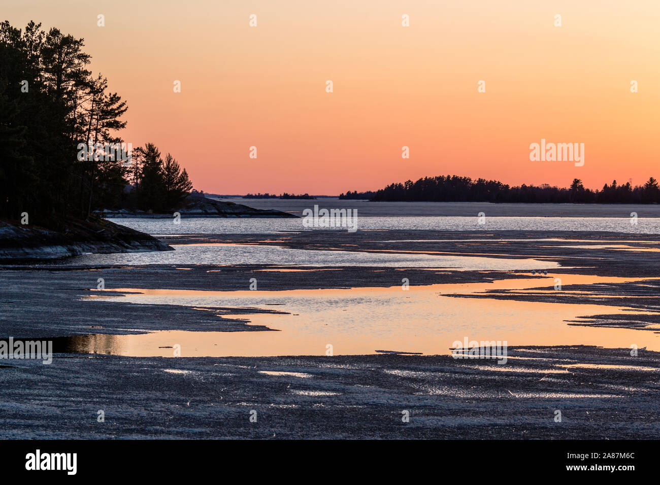 Sunset reflected off the water near Ash River Visitor Center in ...
