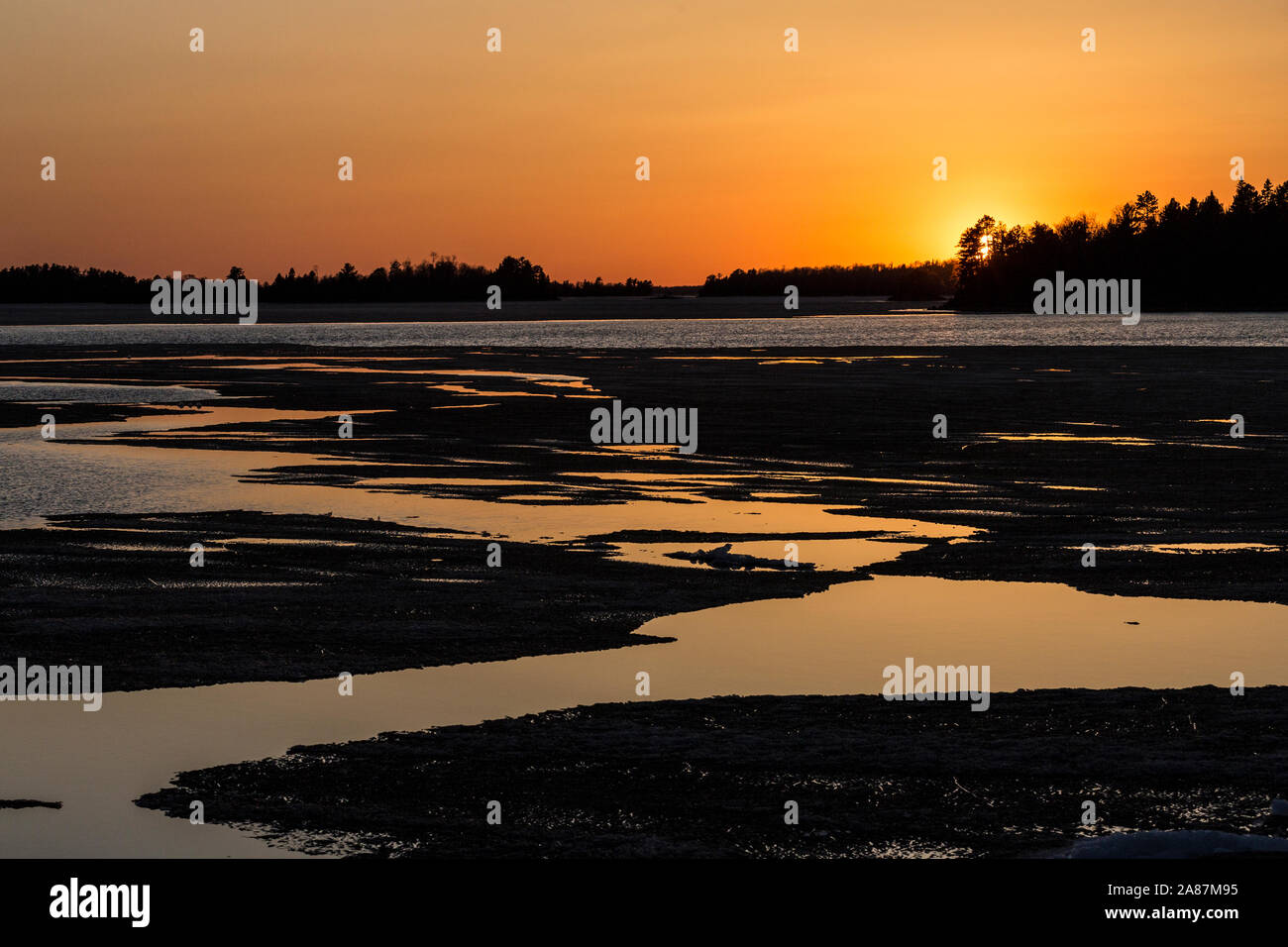 Sunset reflected off the water near Ash River Visitor Center in ...