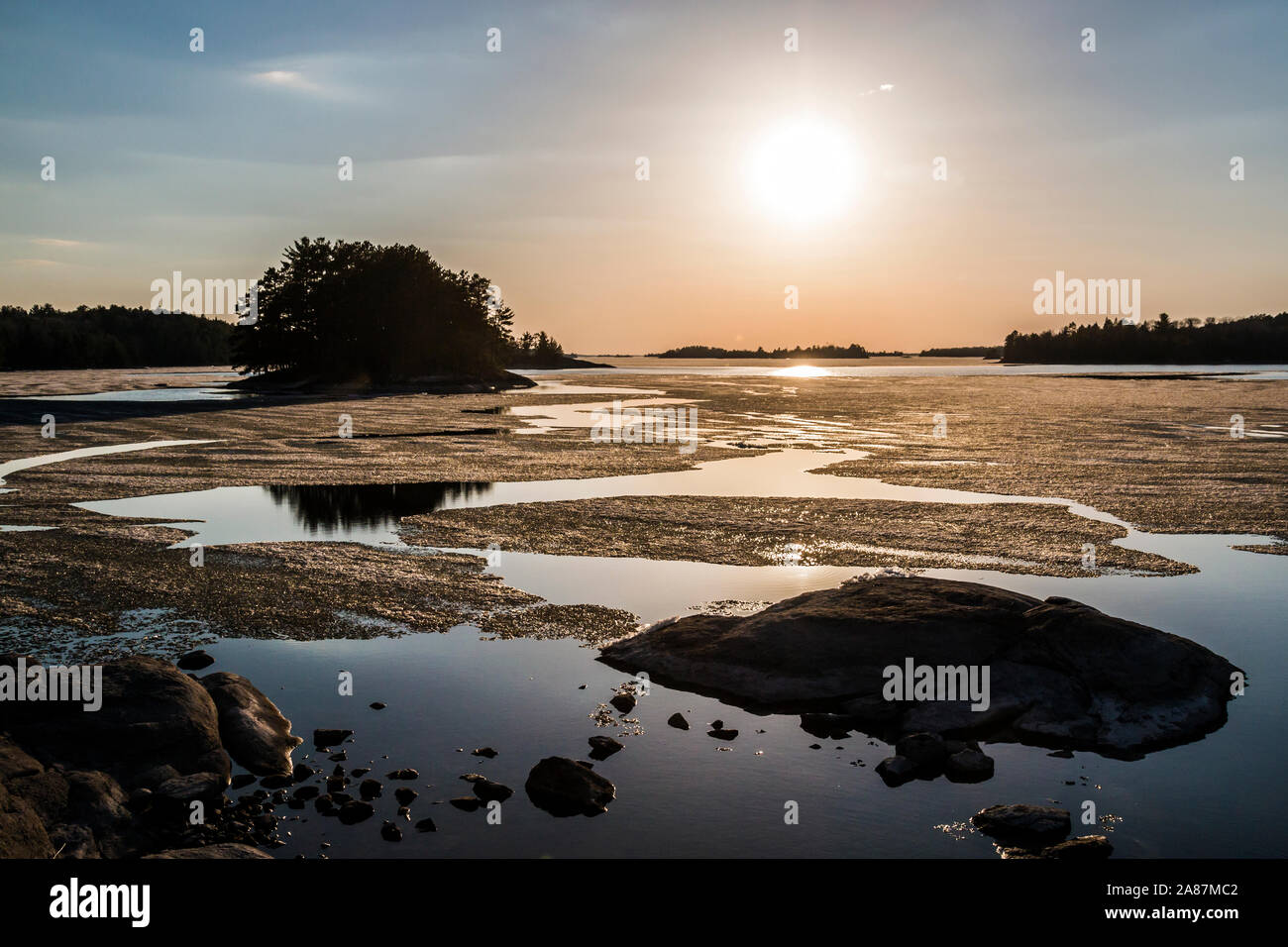 Sunset reflected off the water near Ash River Visitor Center in ...