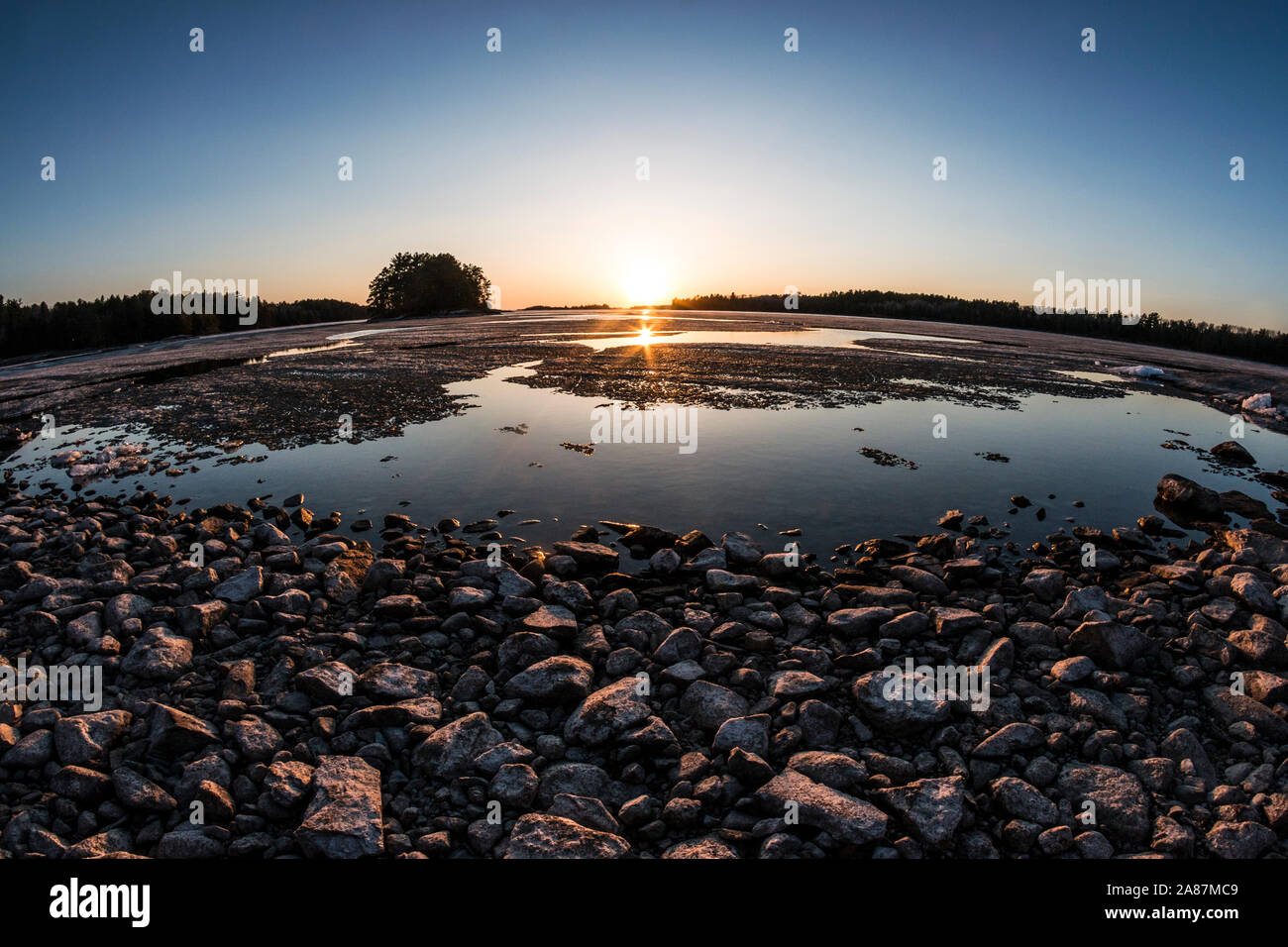 Sunset reflected off the water near Ash River Visitor Center in ...