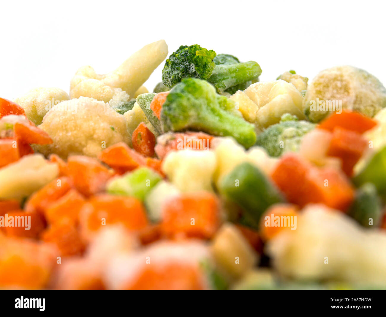 Sliced frozen vegetables on a white background. Food photo Stock Photo ...