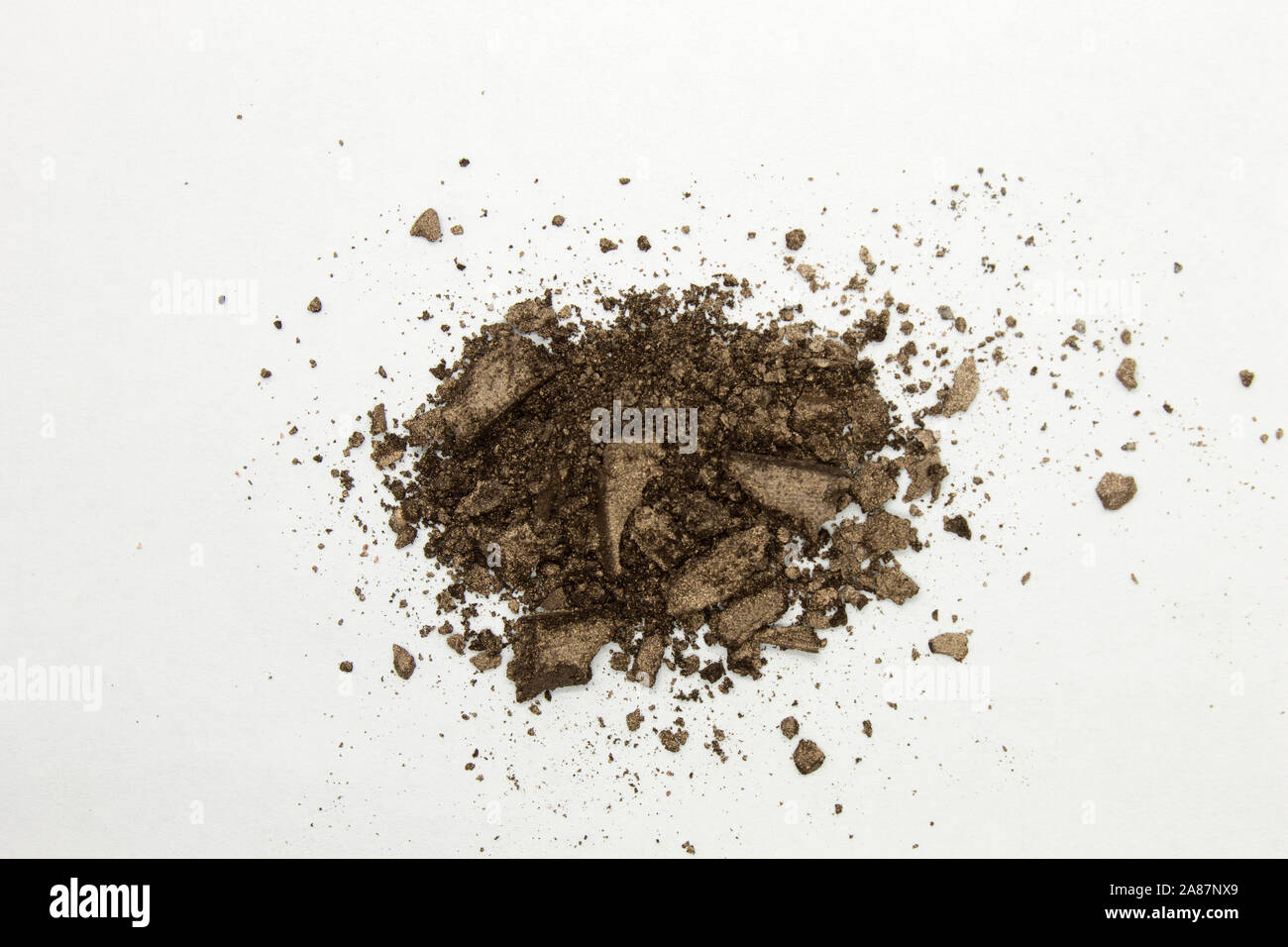 This is a photograph of a Deep Brown shimmery powder Eye shadow ...