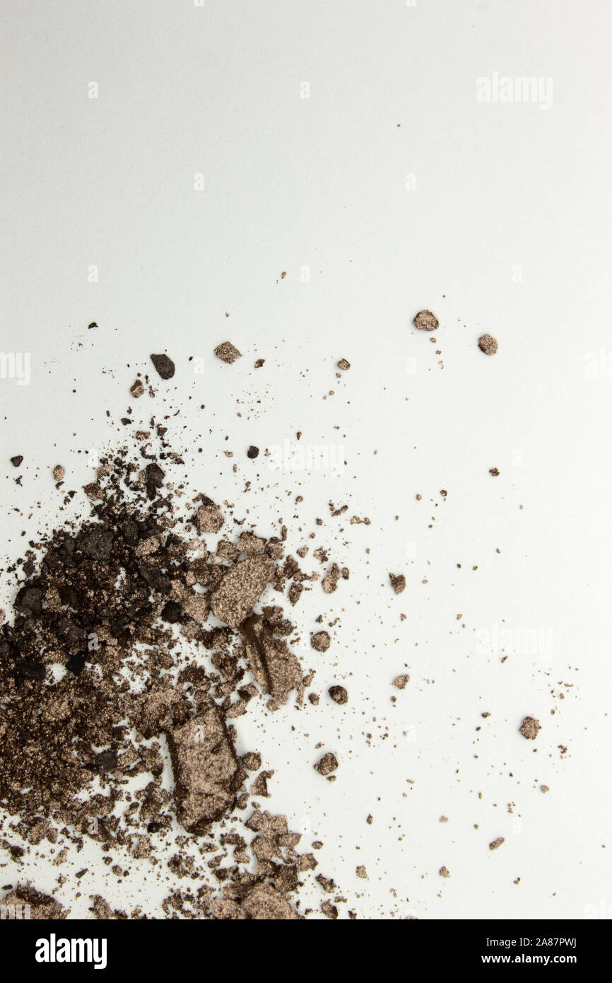 This is a photograph of a light Brown powder Eye shadow isolated on a ...