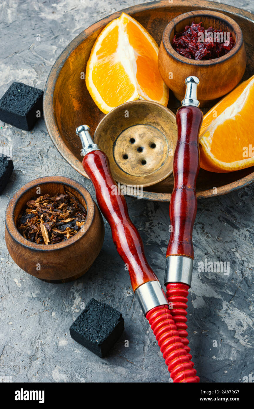 Smoking hookah with the aroma of orange.Details of Oriental hookah ...