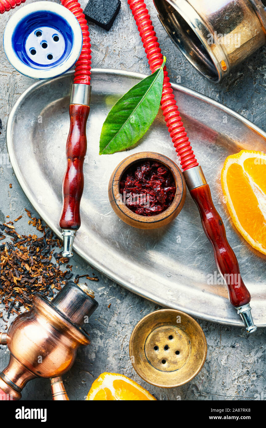Smoking hookah with the aroma of orange.Details of Oriental hookah ...