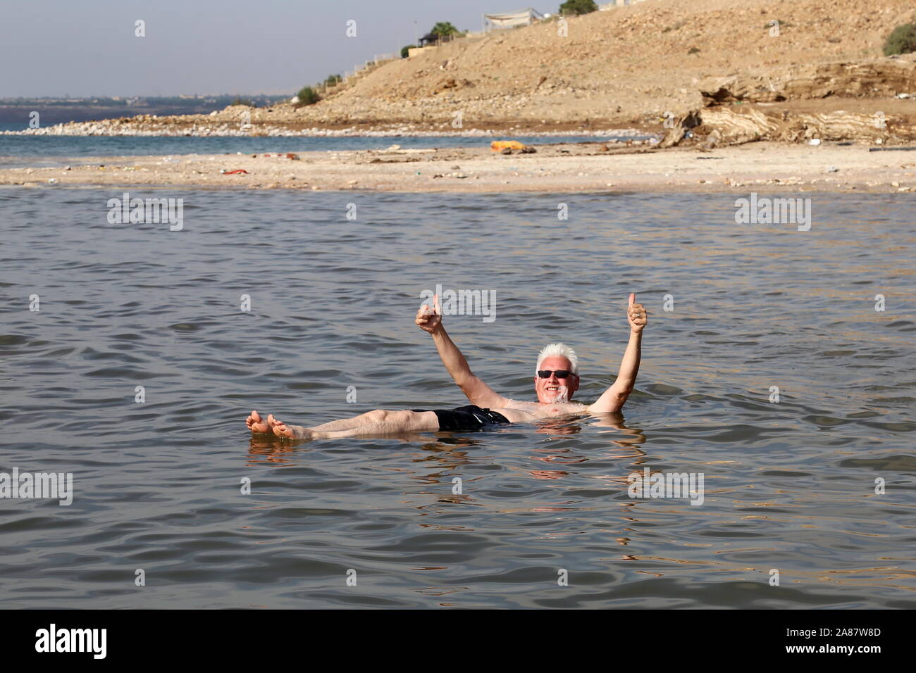 Tourist floating at Amman Beach (private beach resort), Dead Sea ...