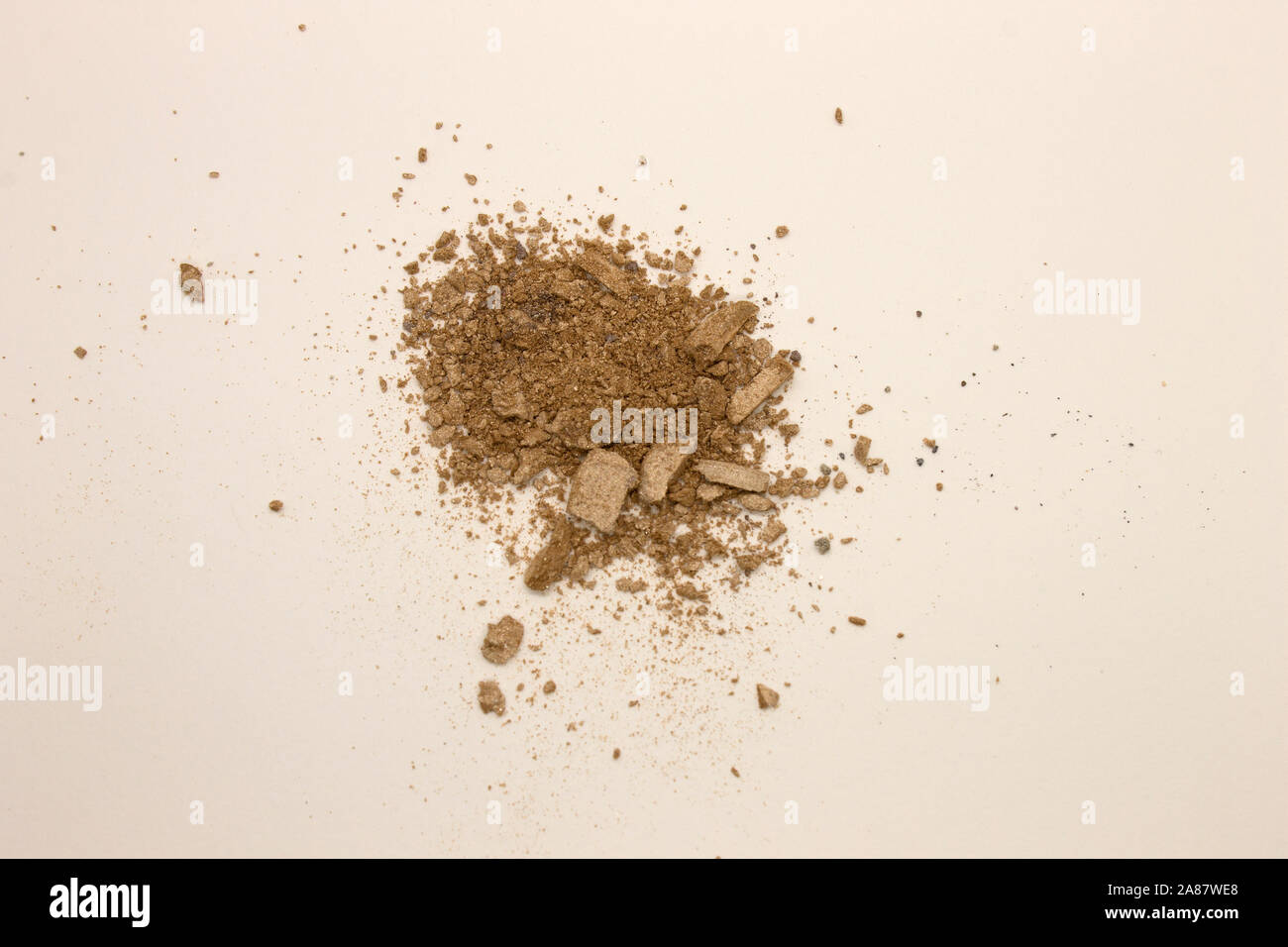 This is a photograph of pale Taupe powder Eye shadow isolated on a ...