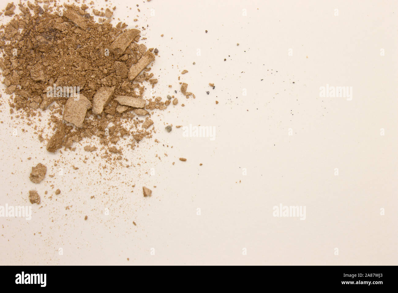 This is a photograph of pale Taupe powder Eye shadow isolated on a ...