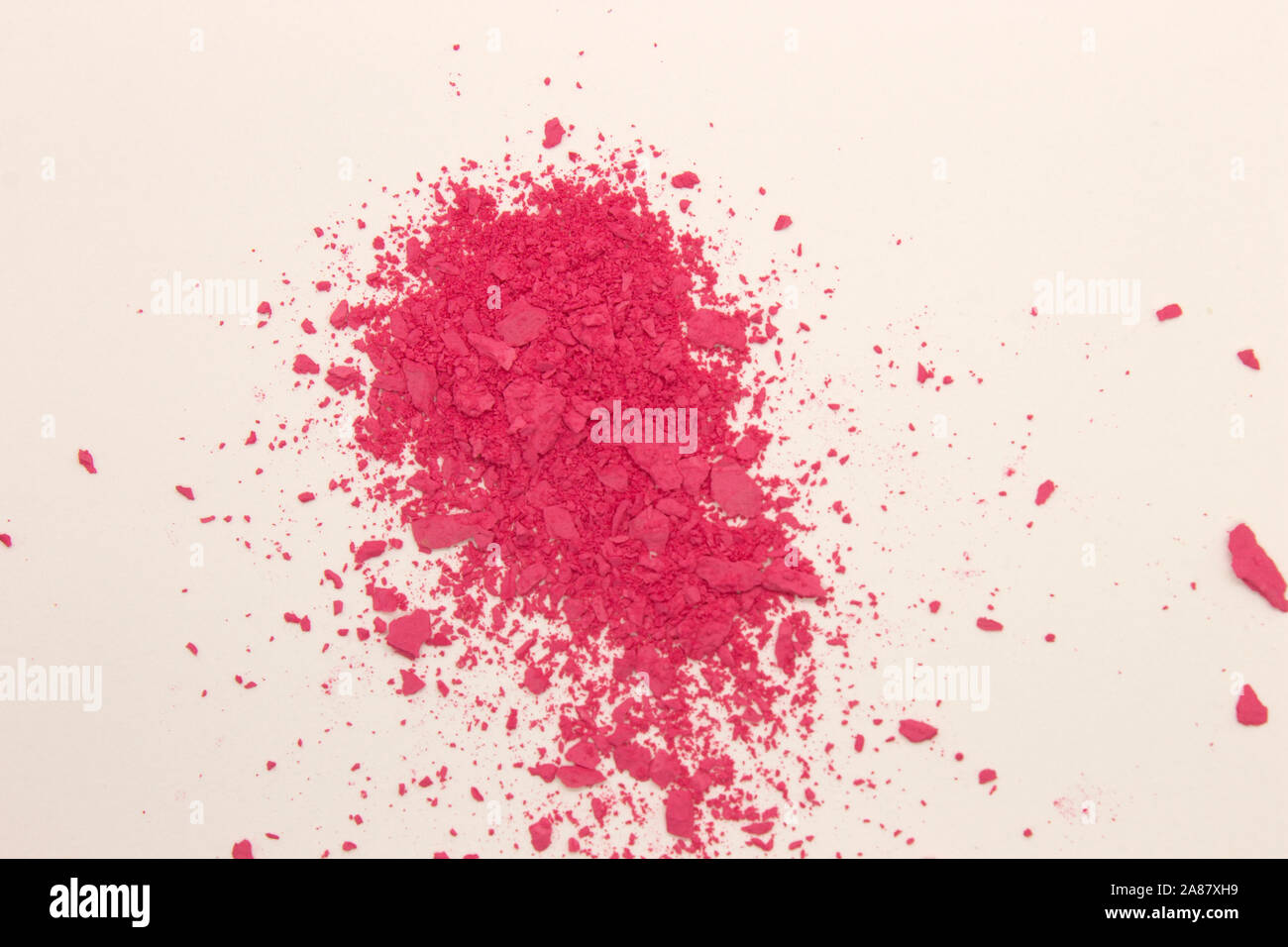 This is a photograph of Fuschia Pink powder Blusher isolated on a White ...