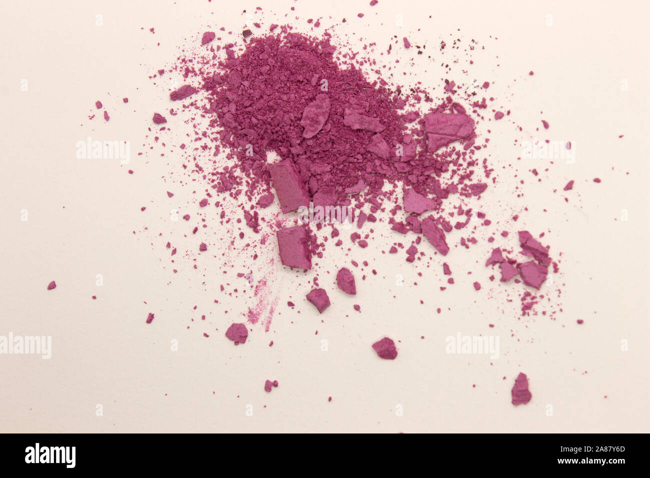 This is a photograph of Purple powder Blusher isolated on a White ...