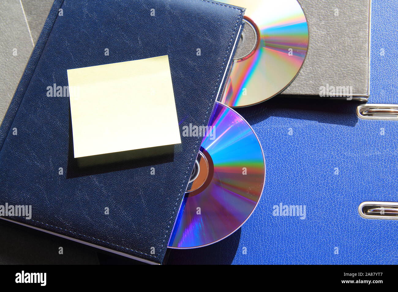 a folder with DVD in a blank notepad Stock Photo - Alamy