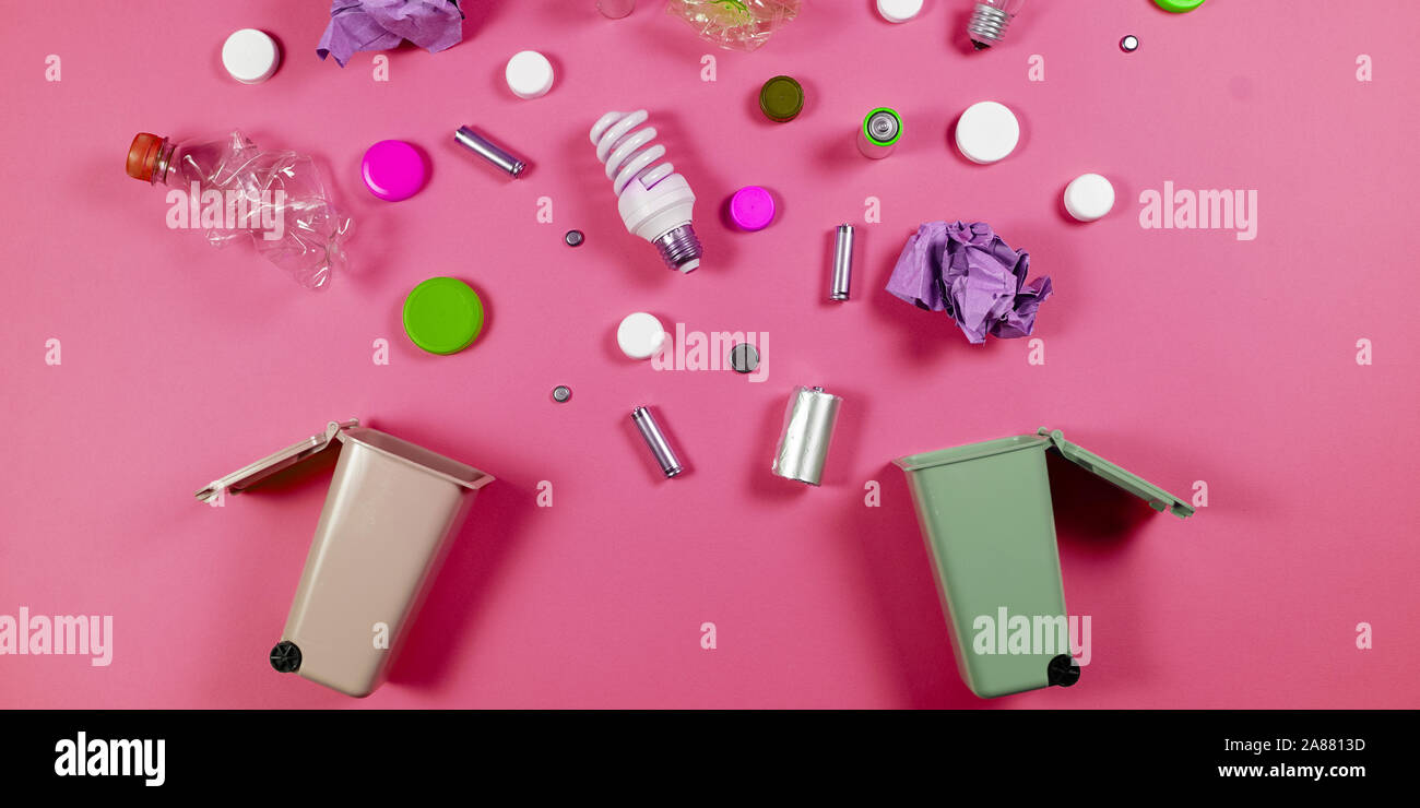 Trash bins and assorted garbage isolated on green, recycle concept, Top ...