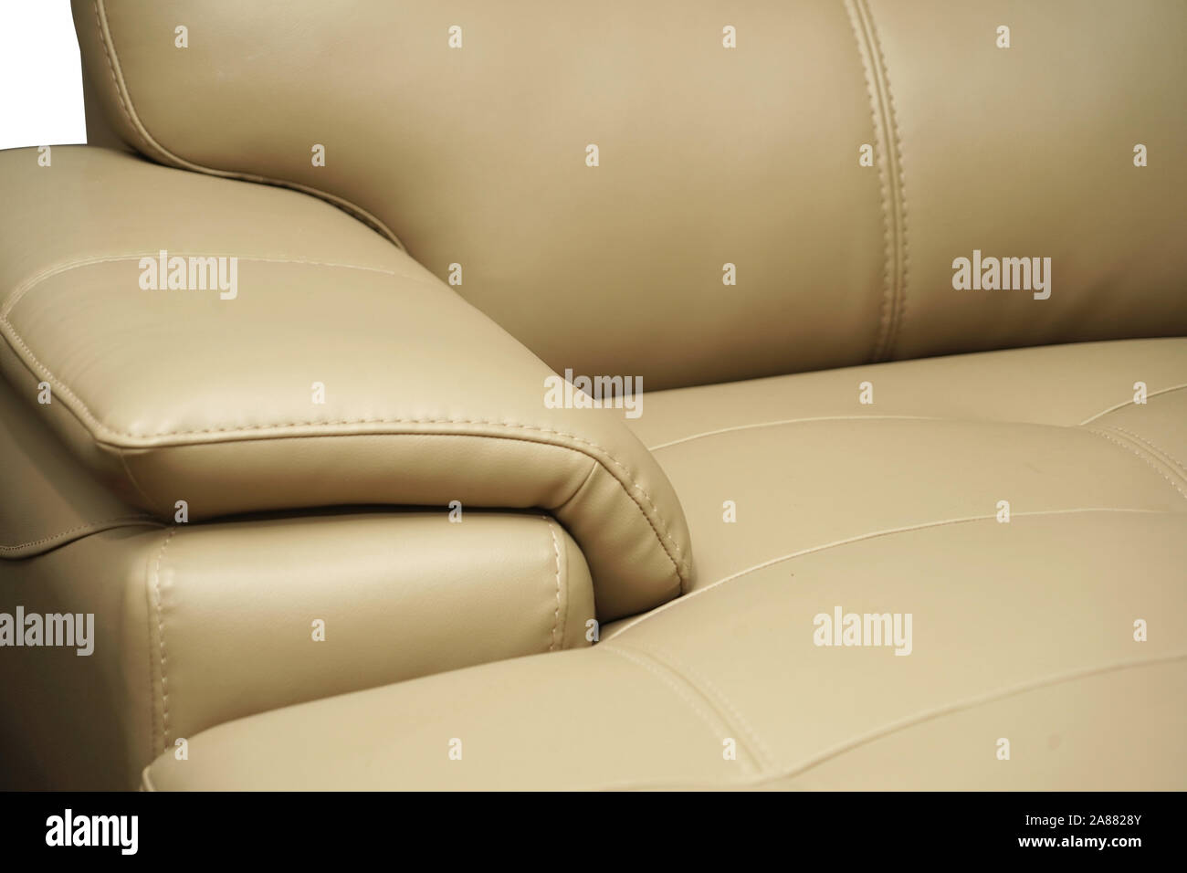 Yellow white leather sofa, close up detail. Furniture showroom ...