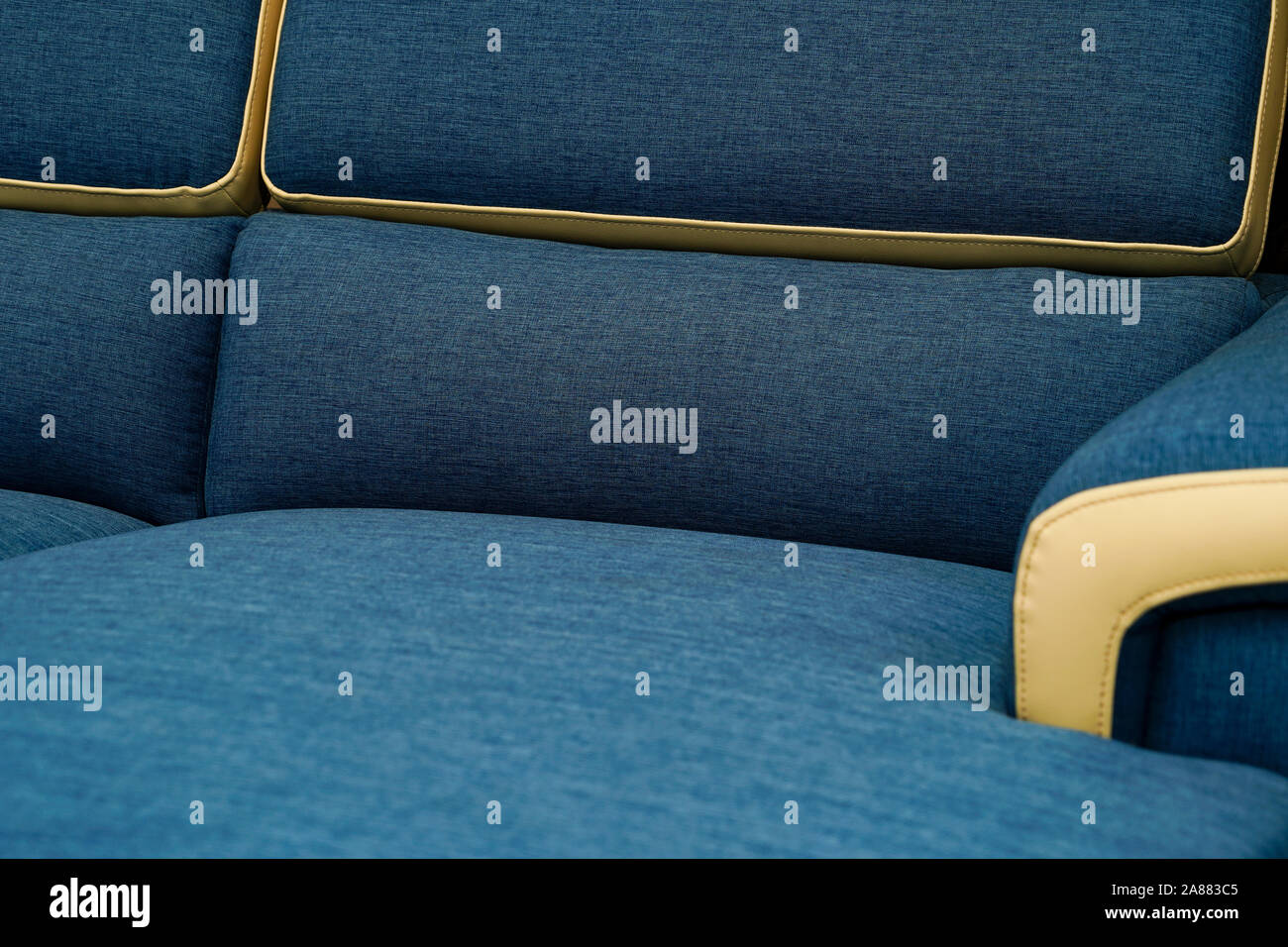 Light blue fabric sofa, close up detail texture. Furniture showroom ...