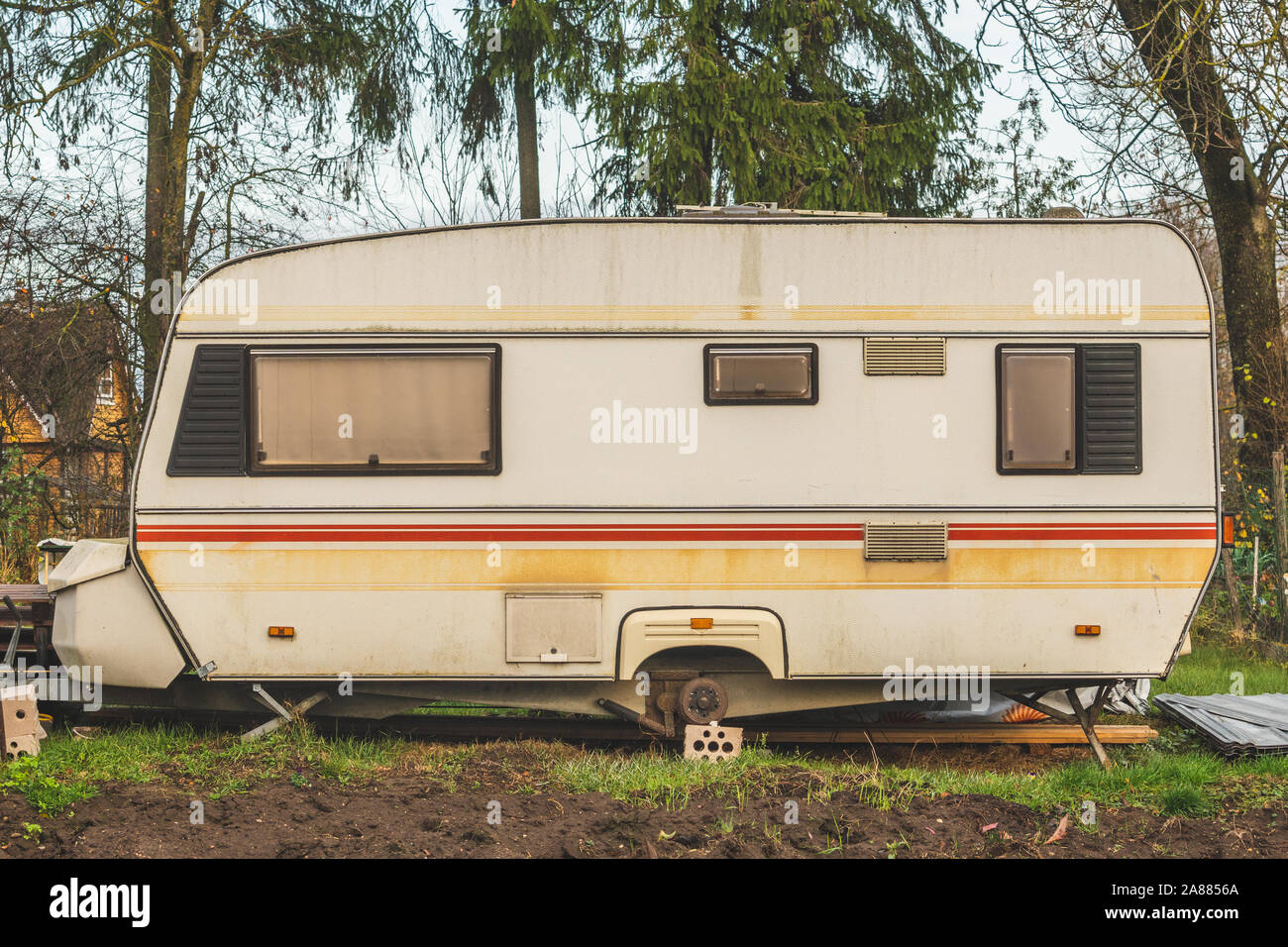 Abandoned vintage caravan/ camper Van parked at the garden Stock Photo ...