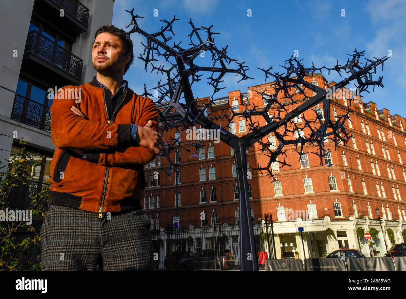 London, UK. 7 November 2019. Conrad Shawcross RA poses next to his new ...