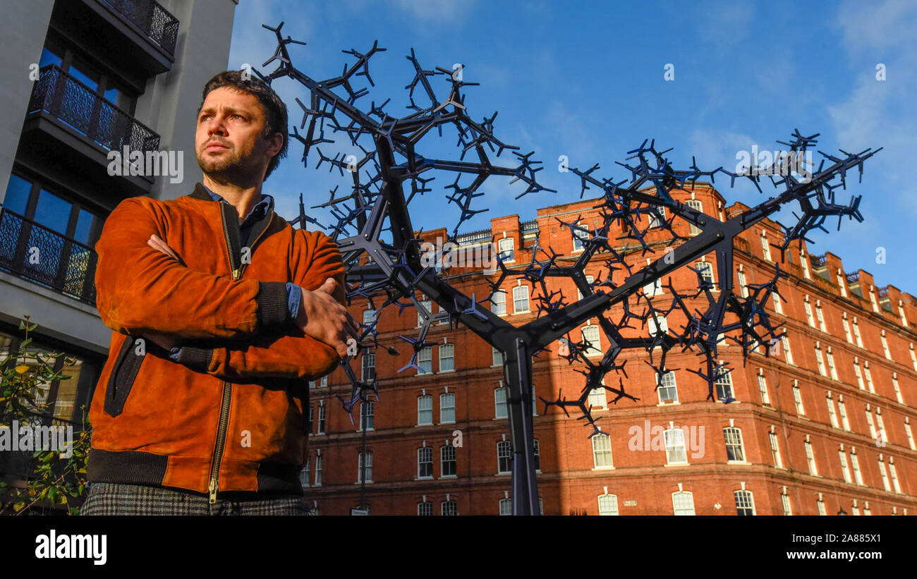 London, UK. 7 November 2019. Conrad Shawcross RA poses next to his new ...