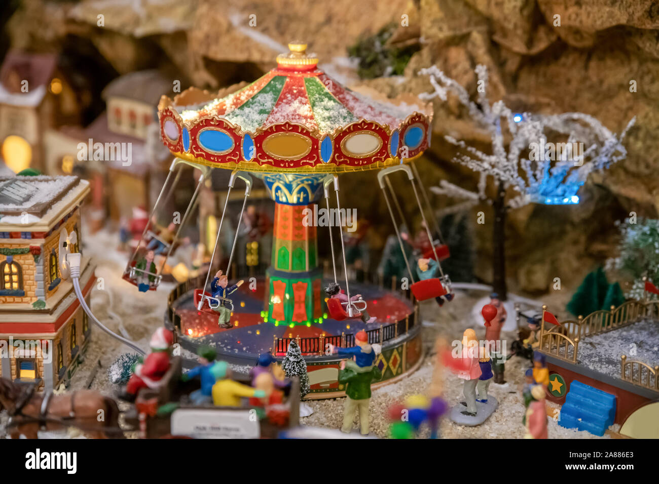 Amusement park in miniature with carousels in winter Stock Photo - Alamy