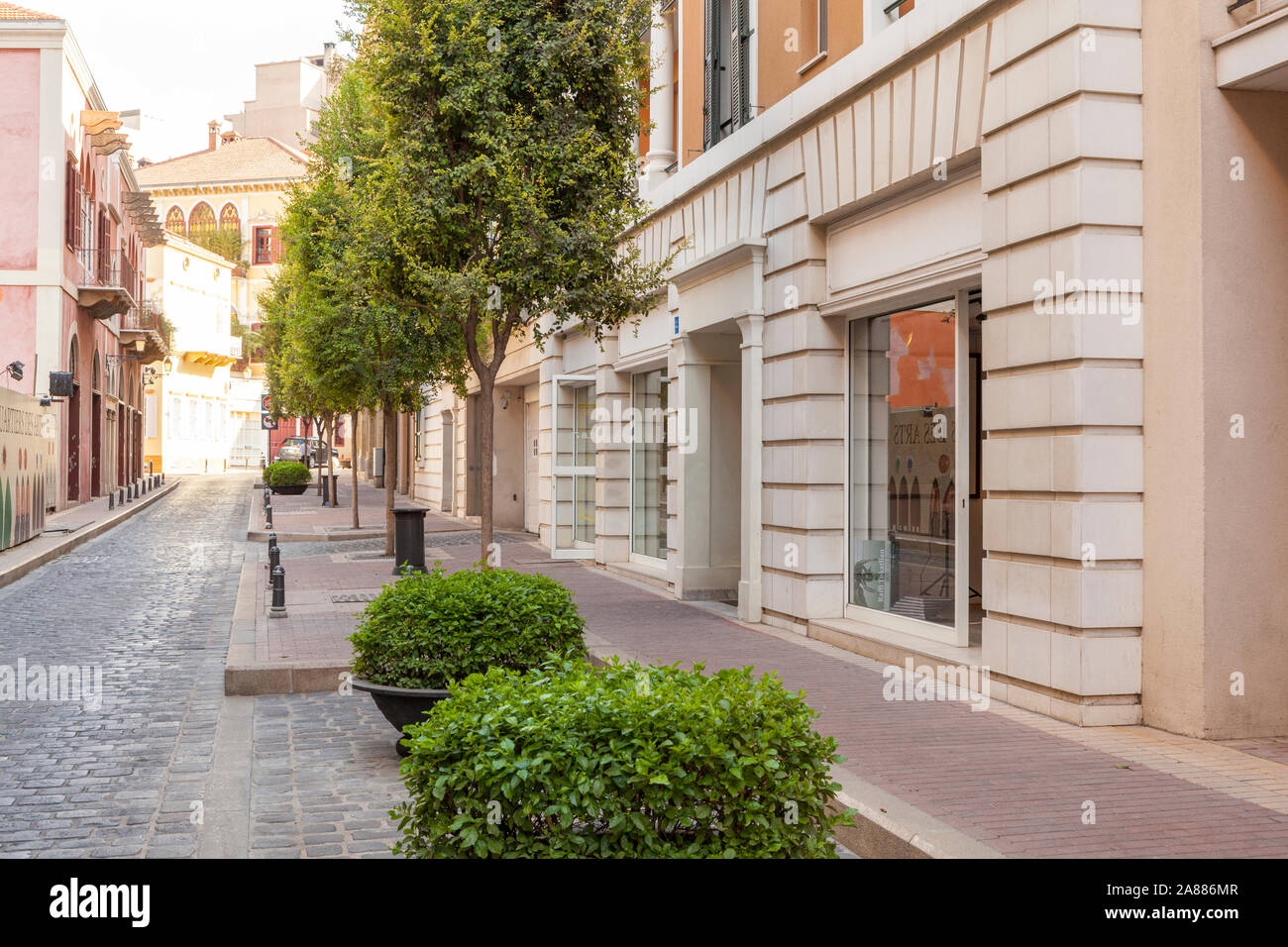 Shops and boutiques on a cobblestone street in Saifi Village, Beirut ...